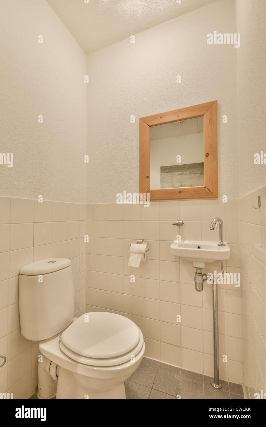 Interior of small clean restroom in miniature style Stock Photo - Alamy