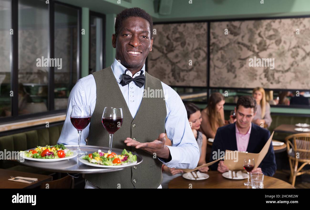 African American waiter with serving tray Stock Photo - Alamy