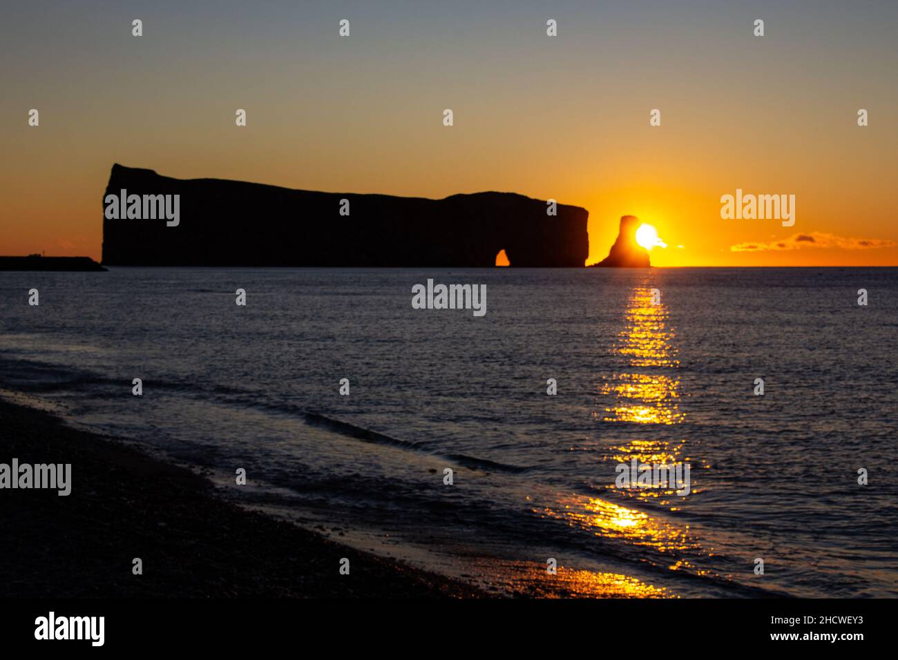 Sunset on Rocher Perce rock in Gaspe Peninsula, Quebec, Gaspesie region ...