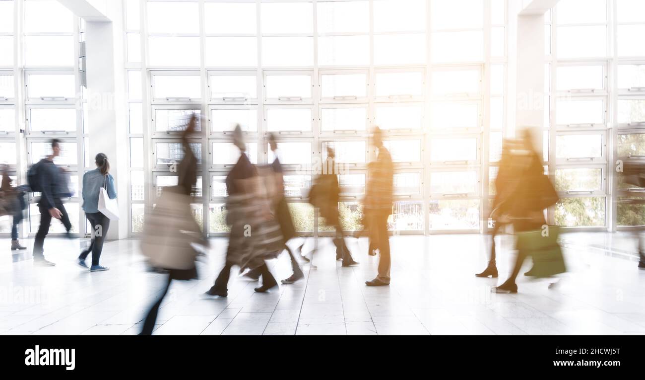 Exhibition visitors moving in a modern hall Stock Photo - Alamy