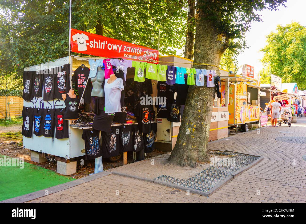 Small stand with funny t-shirts for sale on the street in Ustronie ...