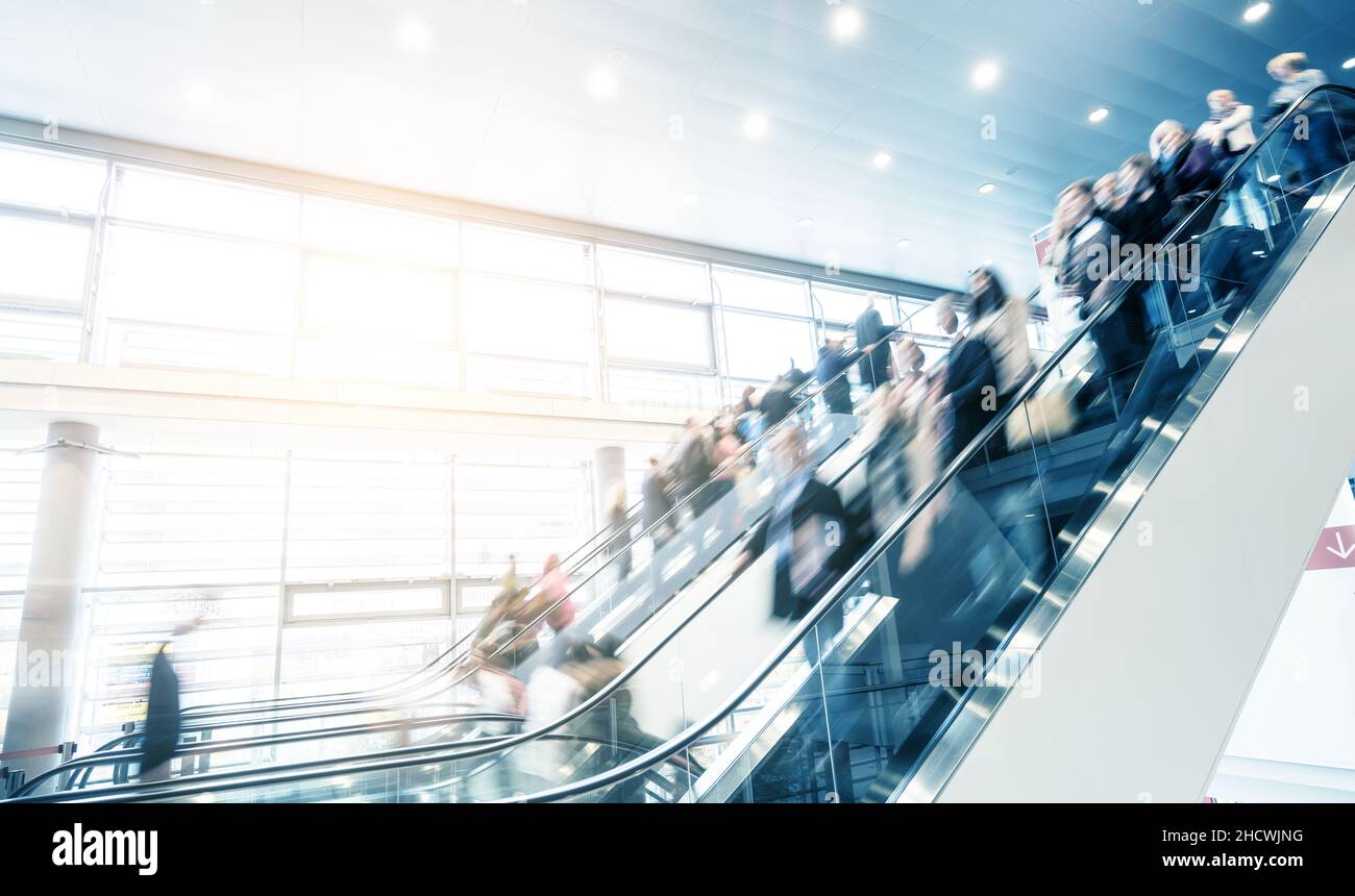 people at a moving escalator on a traid fair Stock Photo - Alamy