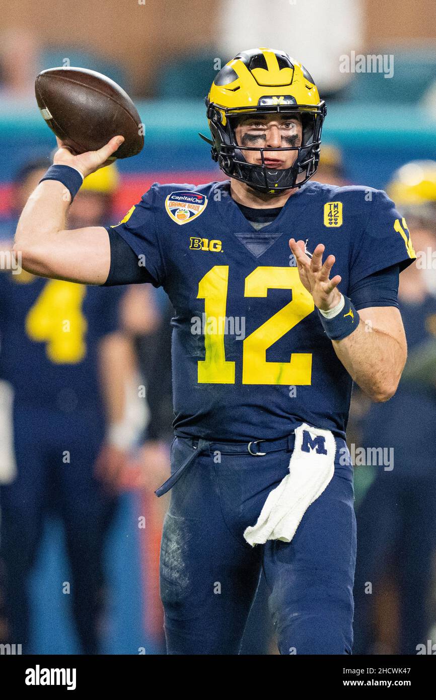 Michigan Wolverines quarterback Cade McNamara (12) throws the ball during the Capital One Orange ...