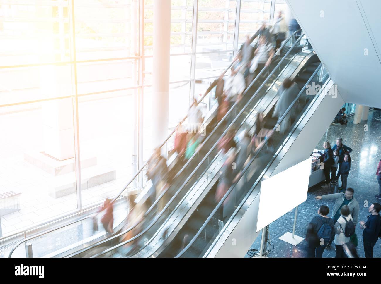trade fair staircase with moving people Stock Photo - Alamy