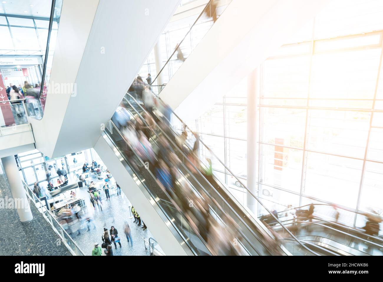 trade fair staircase with moving people Stock Photo - Alamy