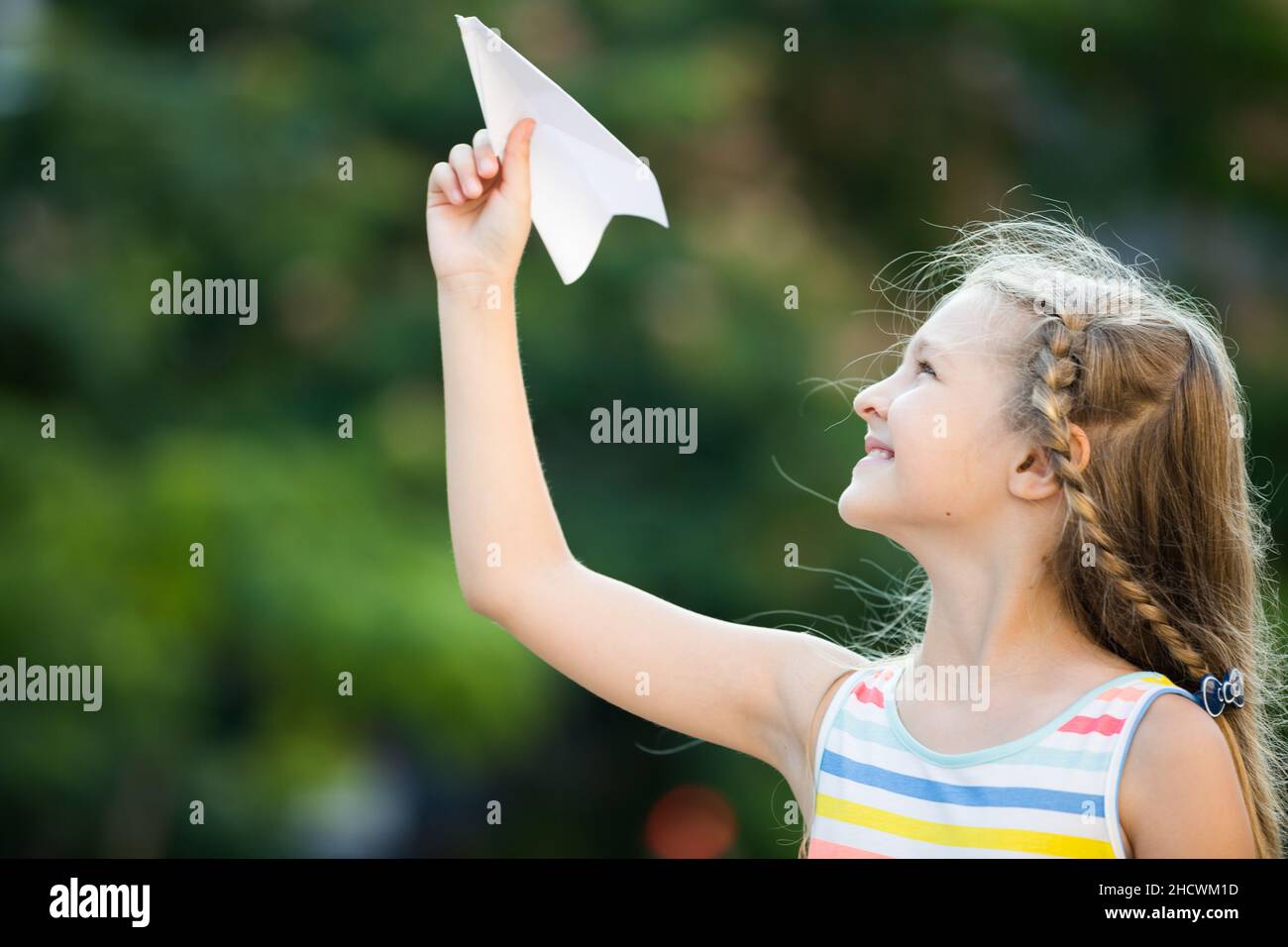 happy girl playing paper plane Stock Photo - Alamy