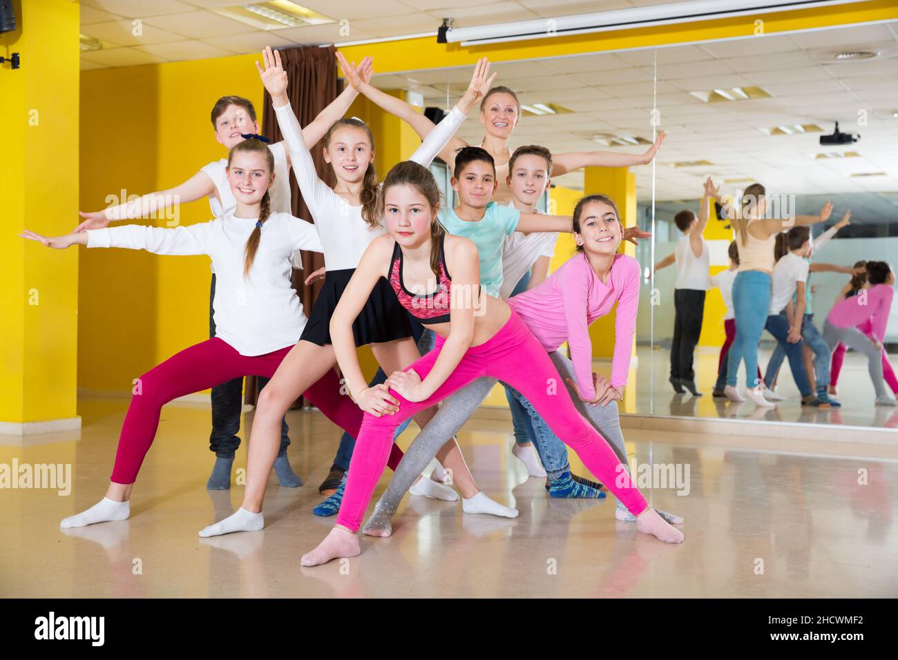 Children having fun in choreography class, posing with trainer Stock ...