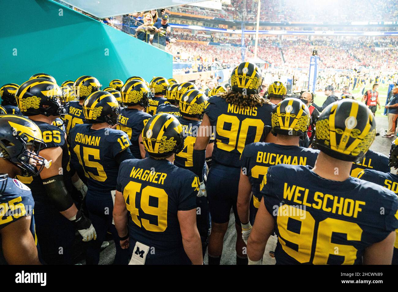 The Michigan Wolverines prepare to take the field at the start of the ...