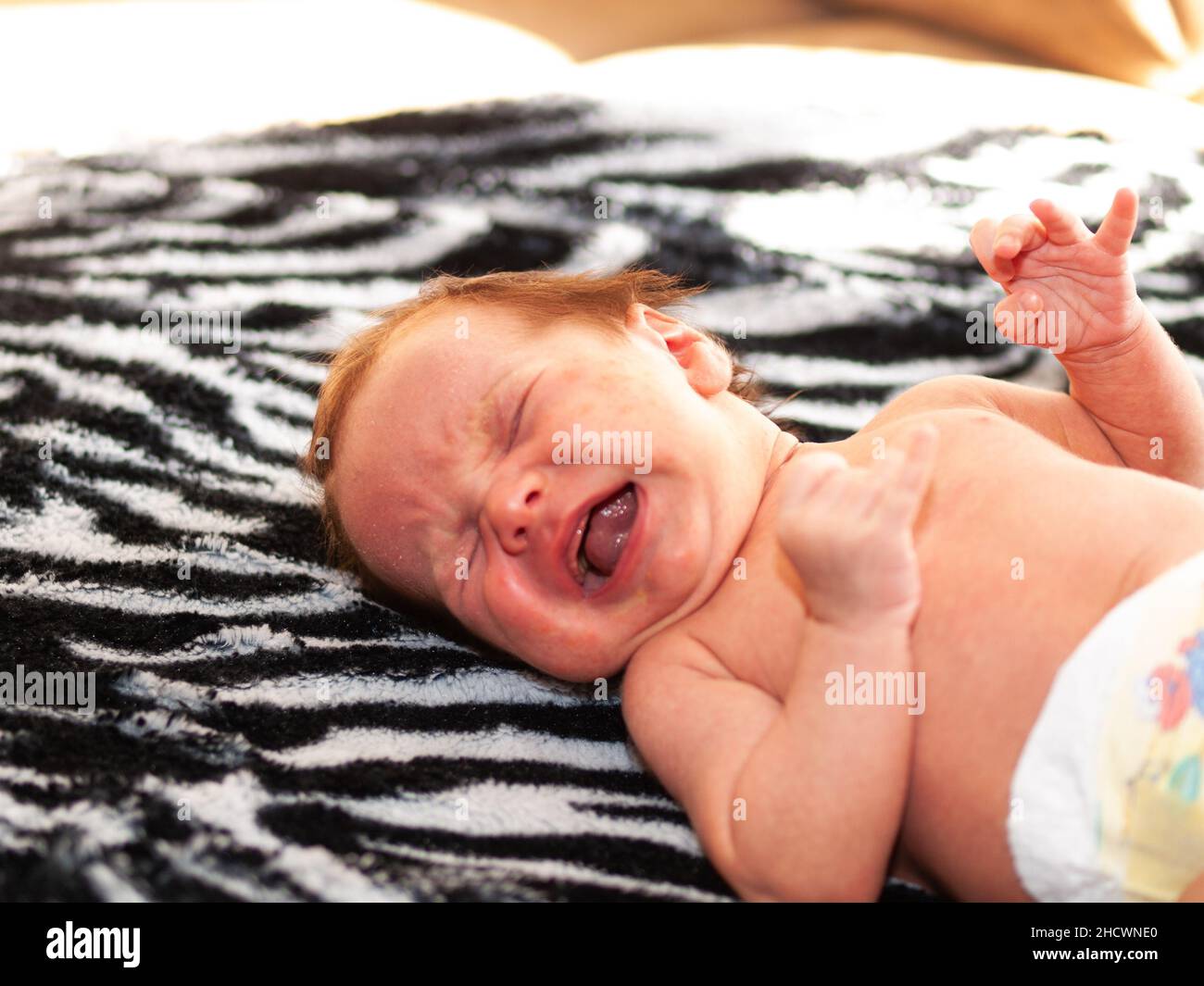 Crying, upset baby boy Stock Photo - Alamy