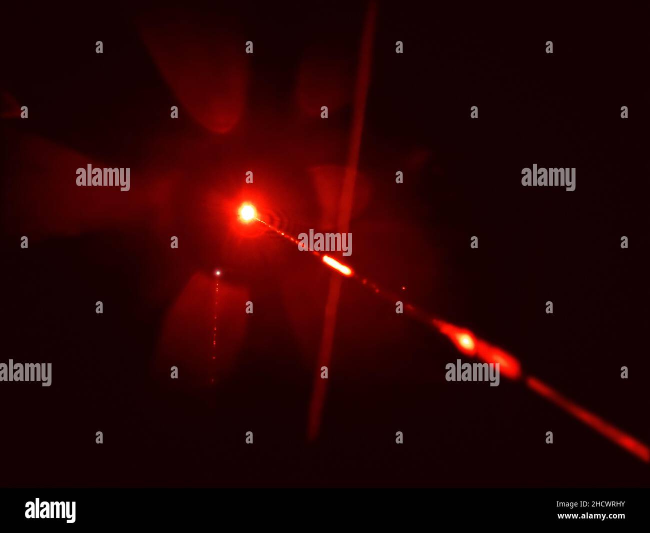 A beautiful view of a red laser beam Stock Photo - Alamy