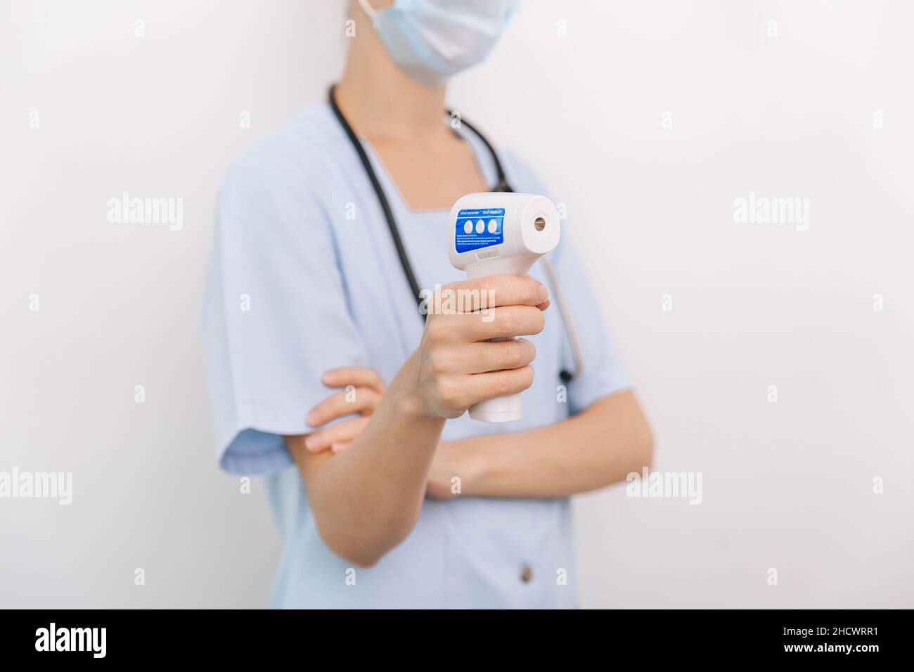 Temperature measurement gun in doctor hands. Close-up shot of doctor ...