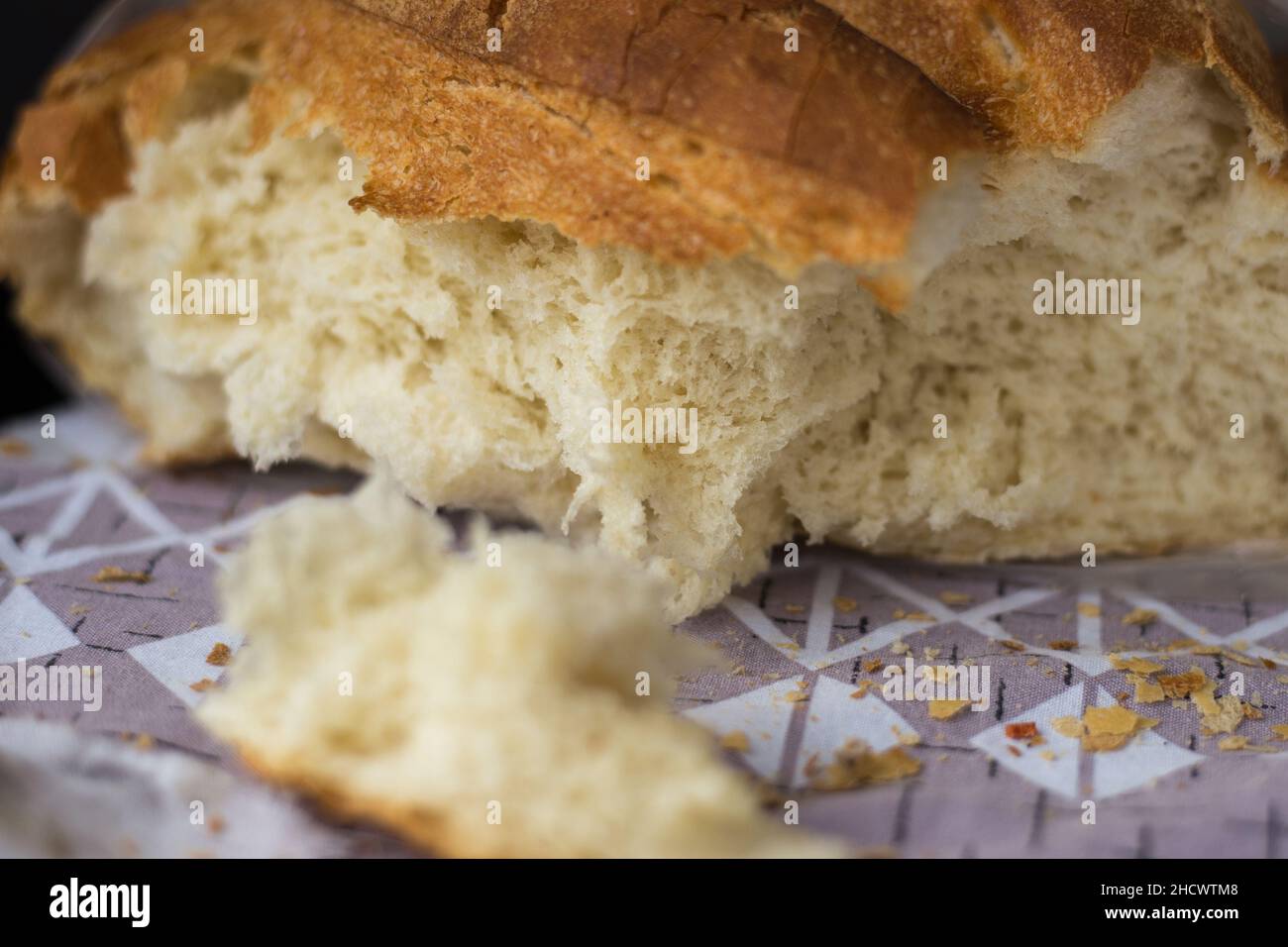 broken crust of fresh fragrant bread close-up, food product ...