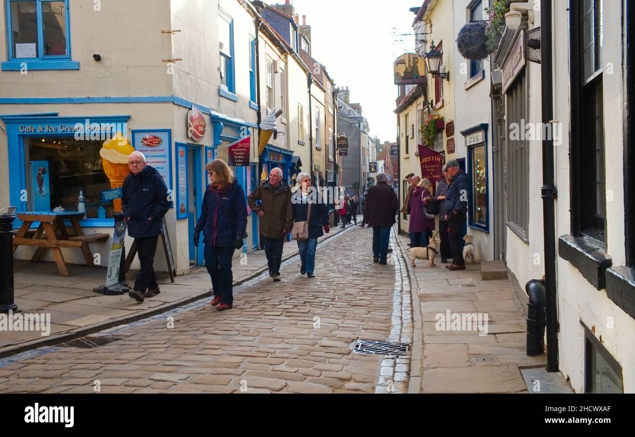 The narrow streets of Whitby are paved with cobbles and often very busy ...