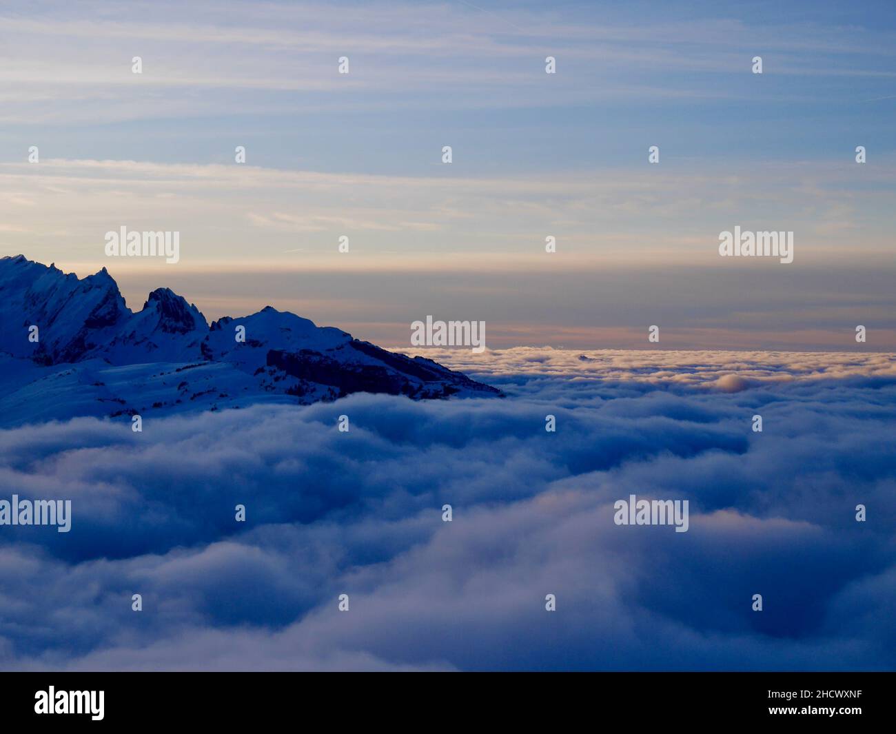 Spectacular view of Alpstein and fog blanket at sunset in winter seen ...