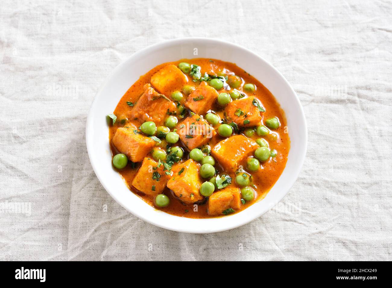 Paneer butter masala. Indian style cottage cheese curry in bowl over ...