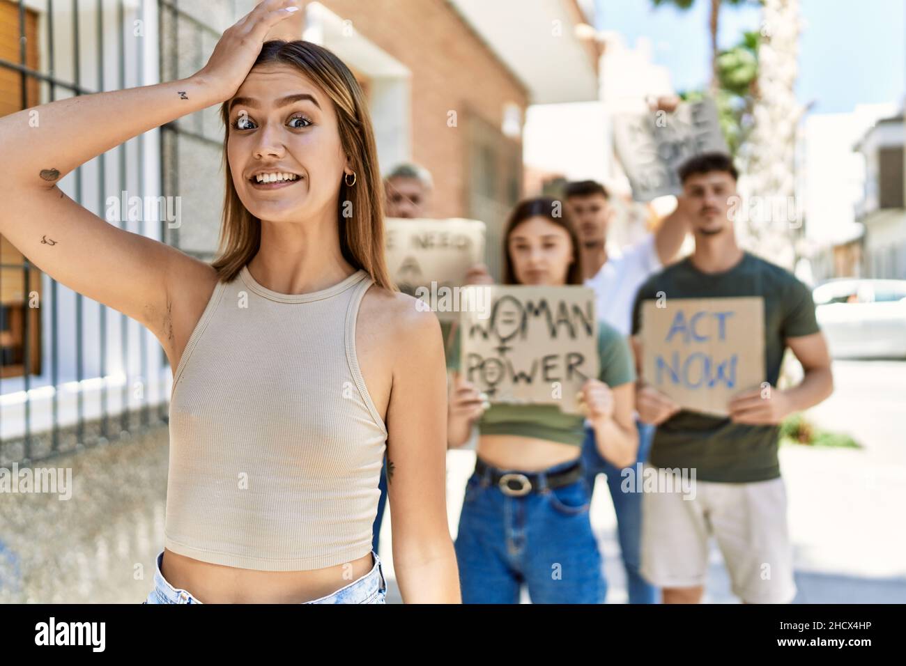 Group of people protesting and giving slogans at the street stressed ...