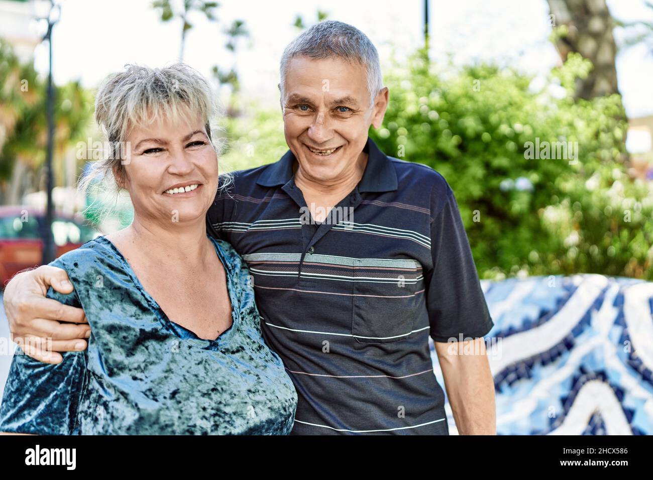 Middle age caucasian couple of husband and wife together on a sunny day ...