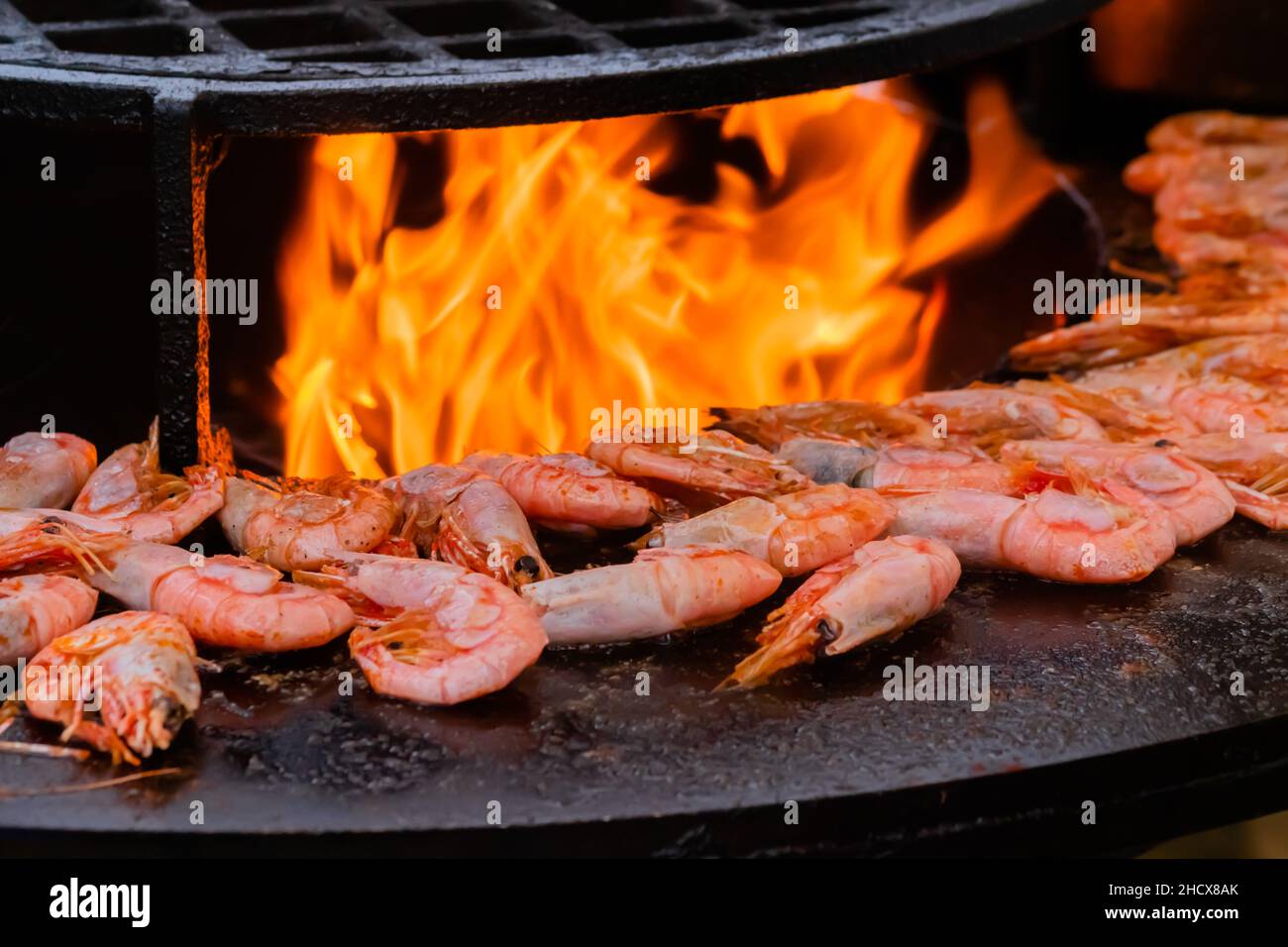 Process of grilling red king prawns on brazier with hot flame Stock ...