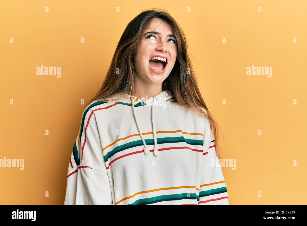 Young caucasian woman wearing casual clothes angry and mad screaming ...