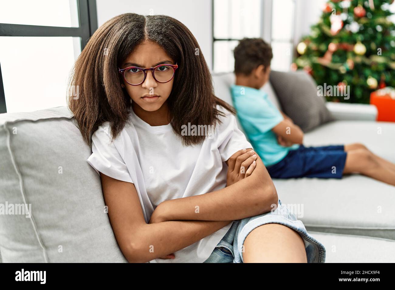 Brother and sister angry having problem sitting on sofa at home Stock ...