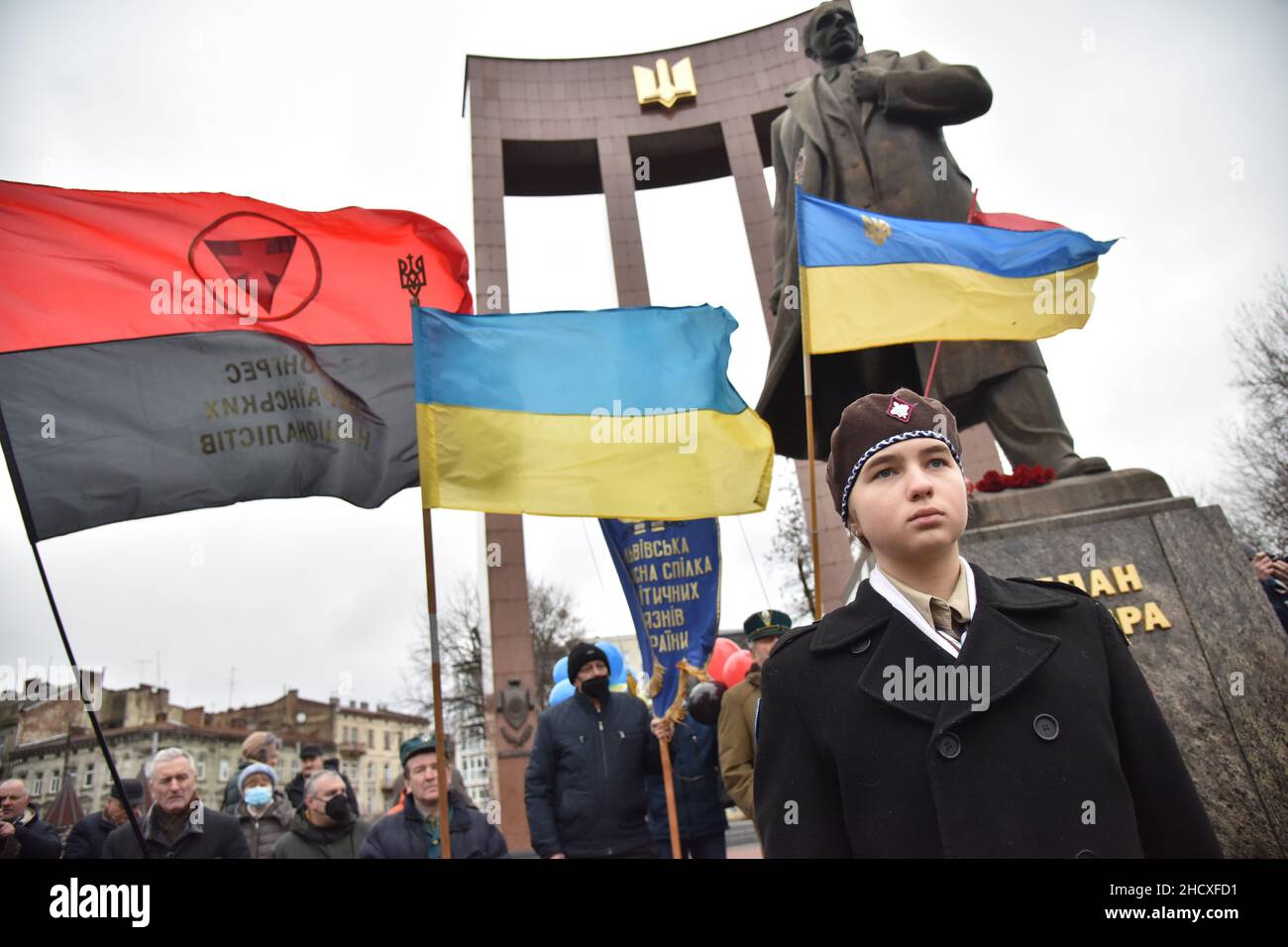 Lviv, Ukraine. 01st Jan, 2022. People hold flags near the monument to ...