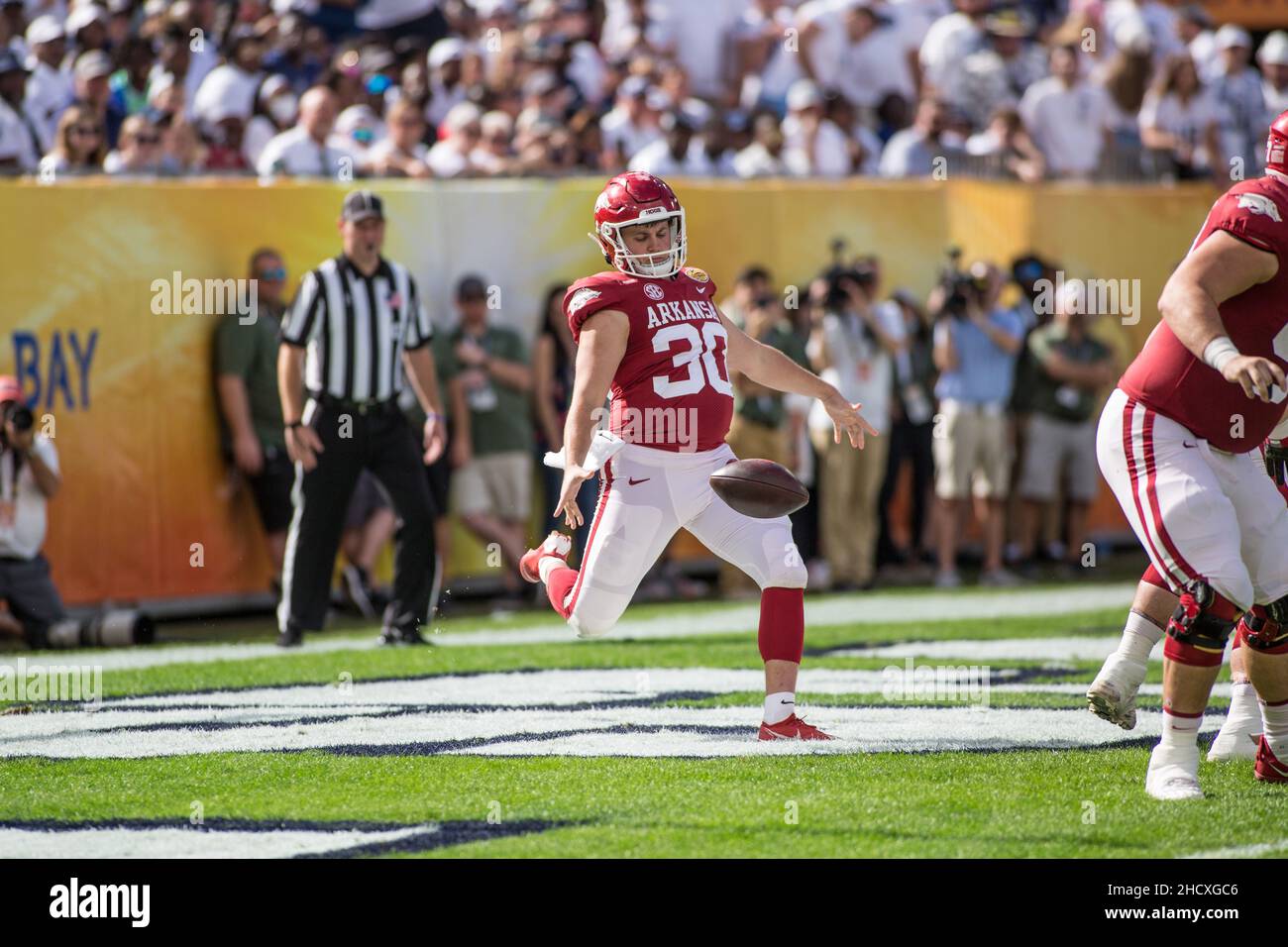 January 1, 2022: Arkansas Razorbacks punter Reid Bauer (30) punts from ...
