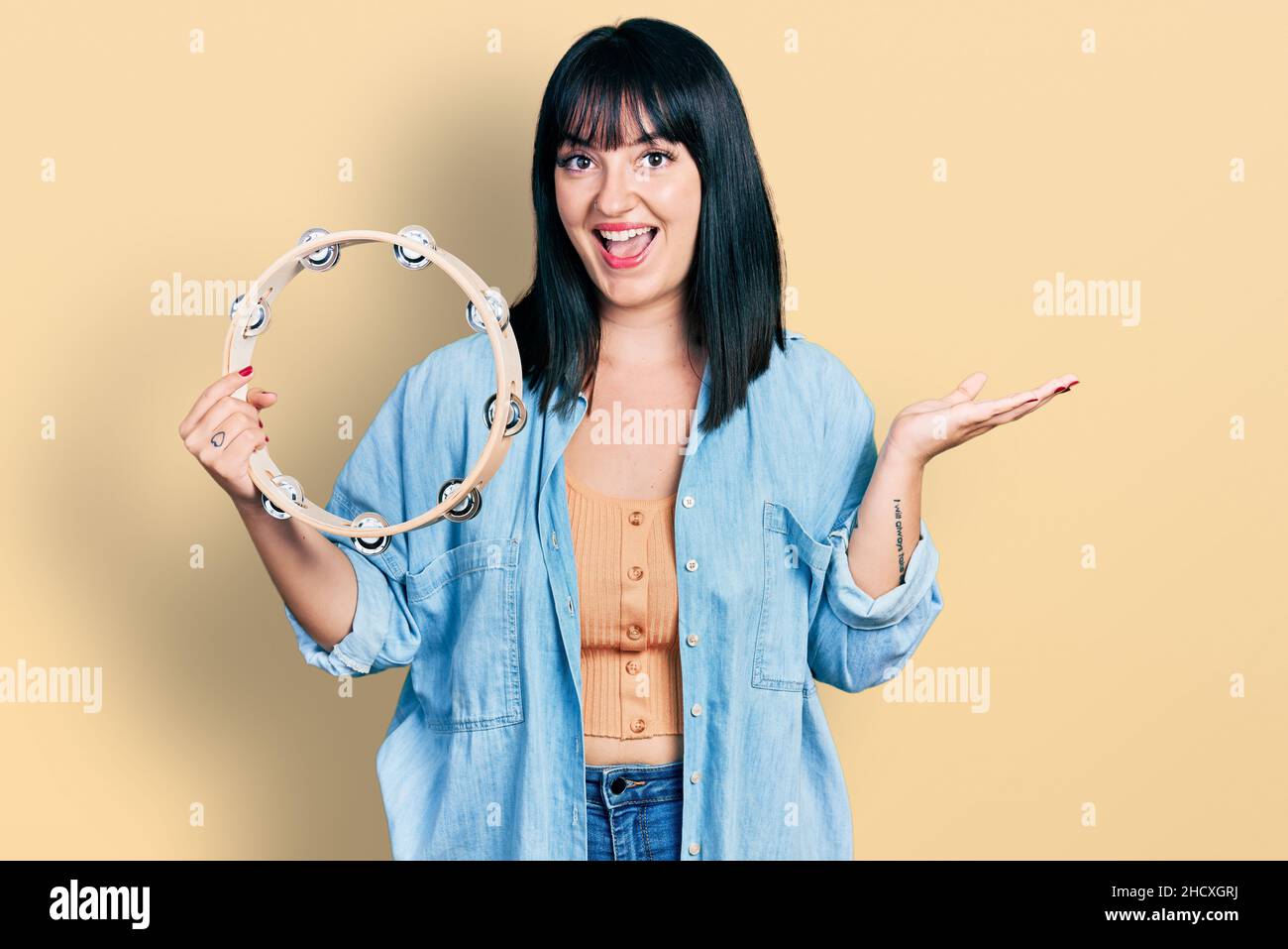Hispanic woman playing drum hi-res stock photography and images - Alamy