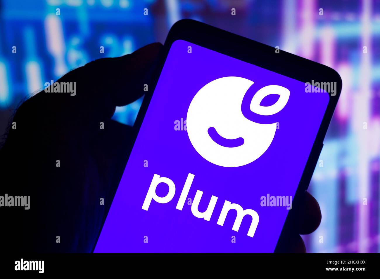 In this photo illustration, the Plum logo seen displayed on a ...