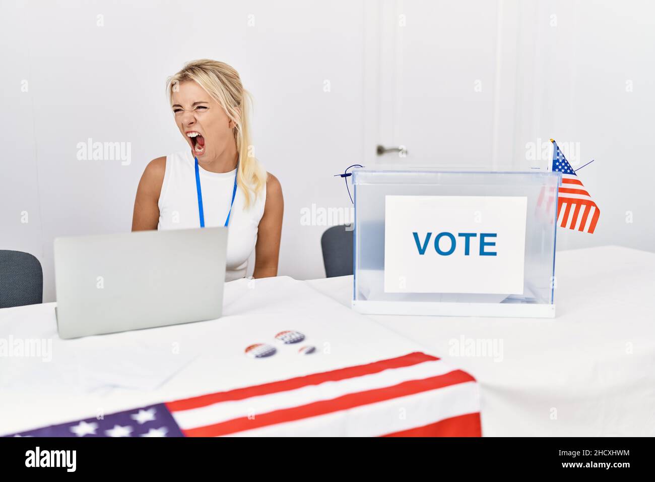 Young caucasian woman at america political campaign election angry and ...