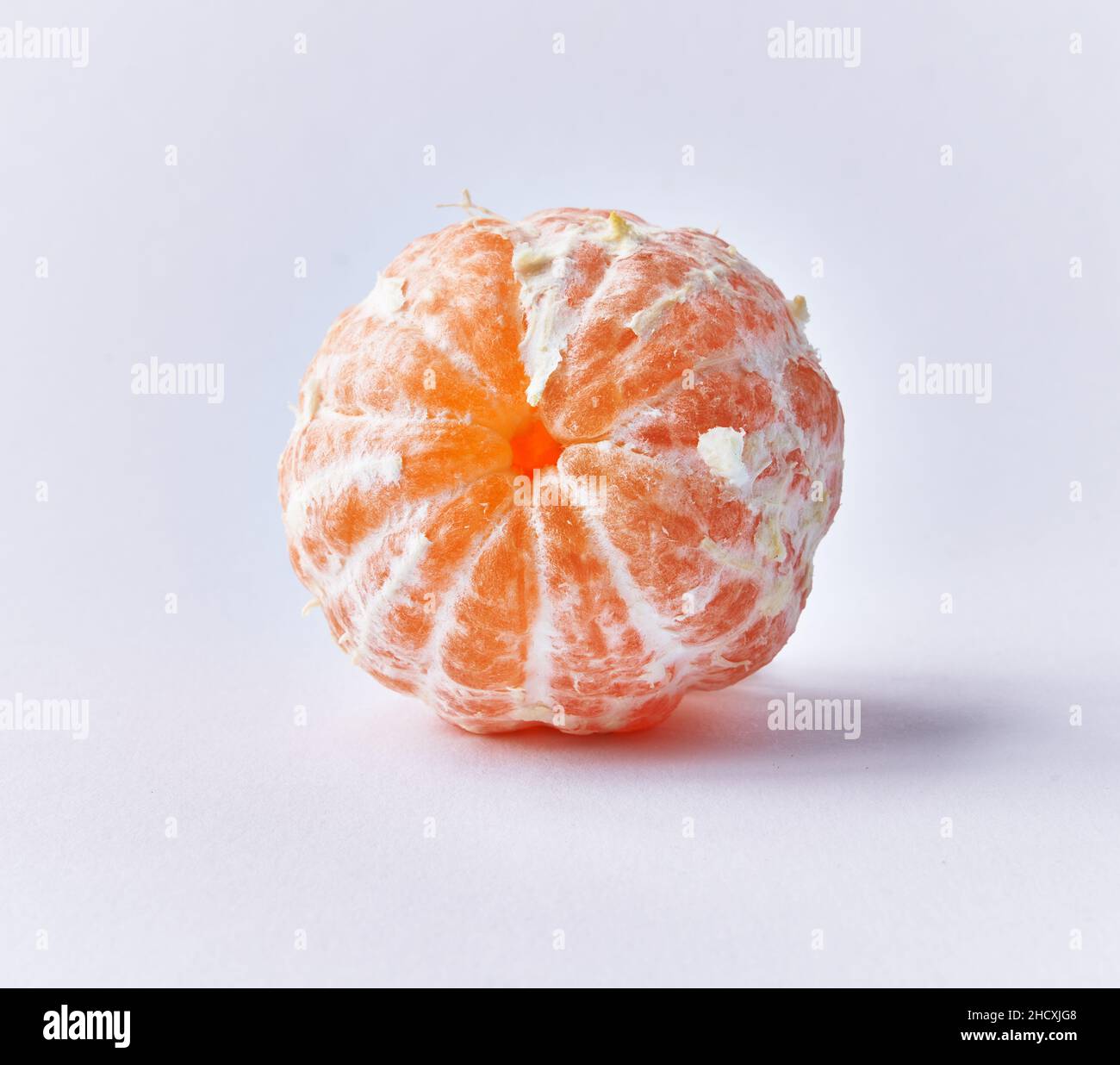 Single peeled tangerine isolated over white background Stock Photo - Alamy