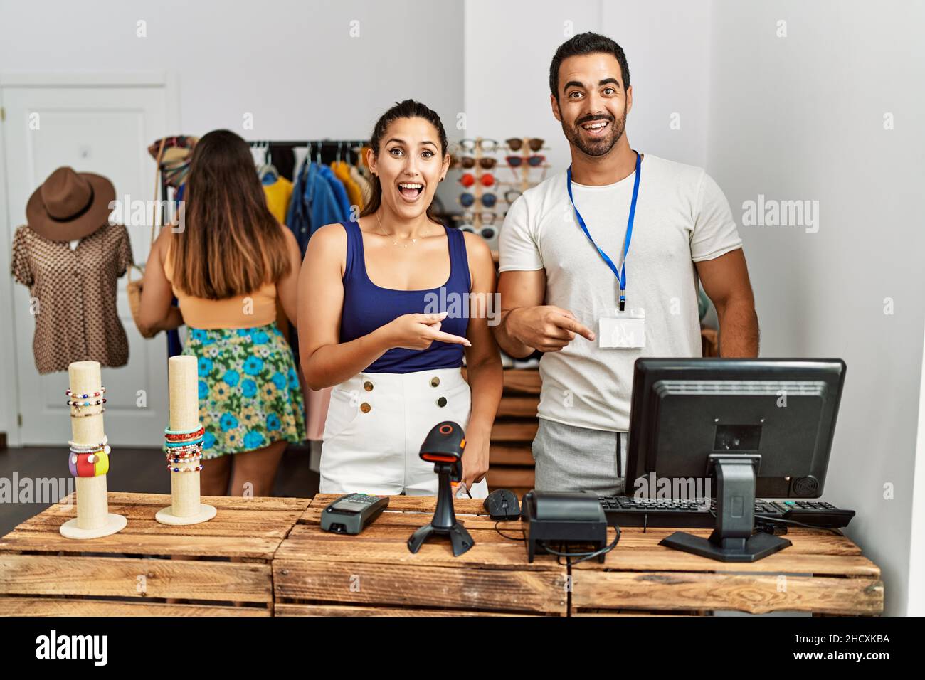 Group of young hispanic people working as manager at retail boutique ...