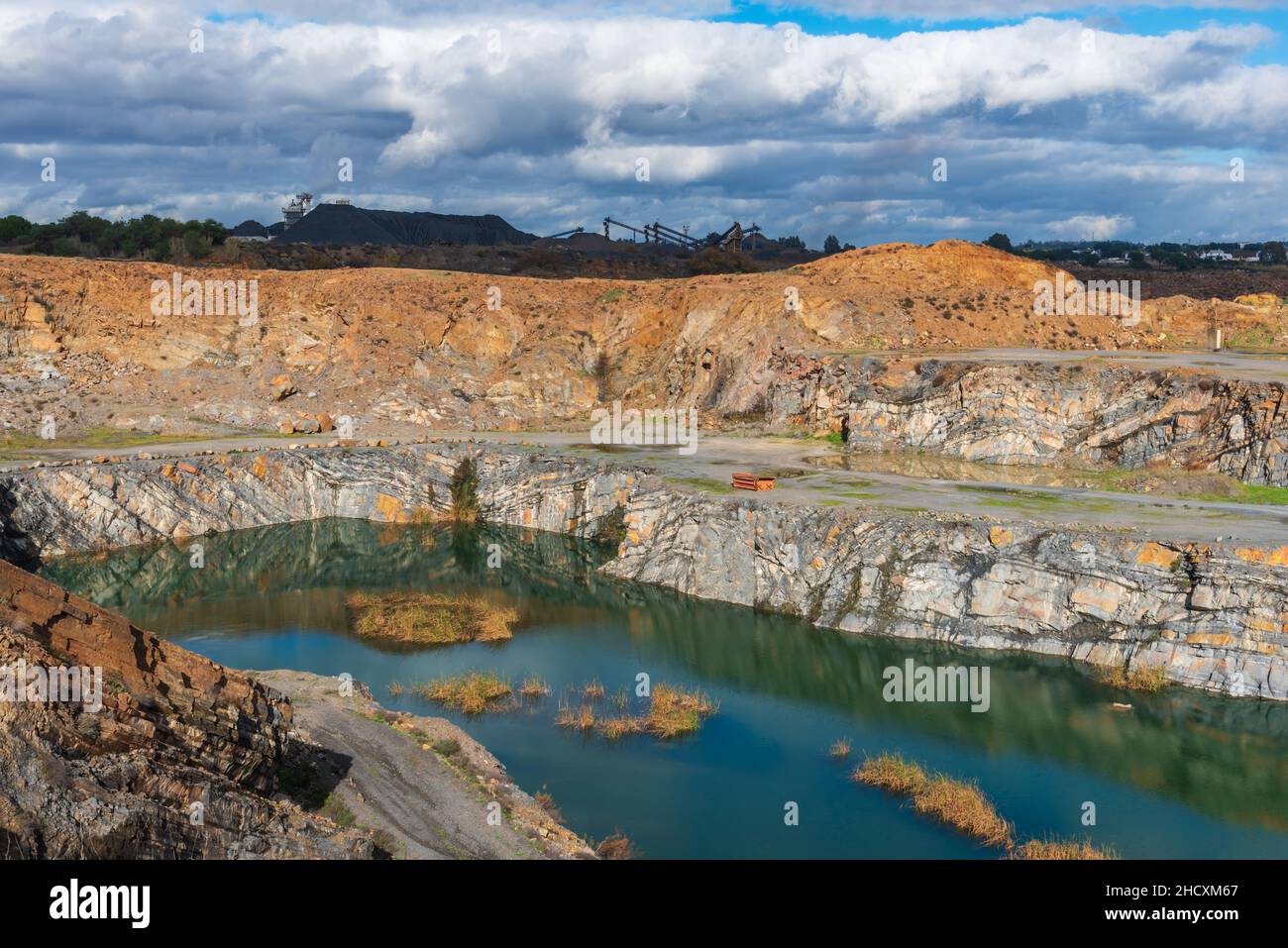 Open pit quarry with several levels in the excavation and the central ...