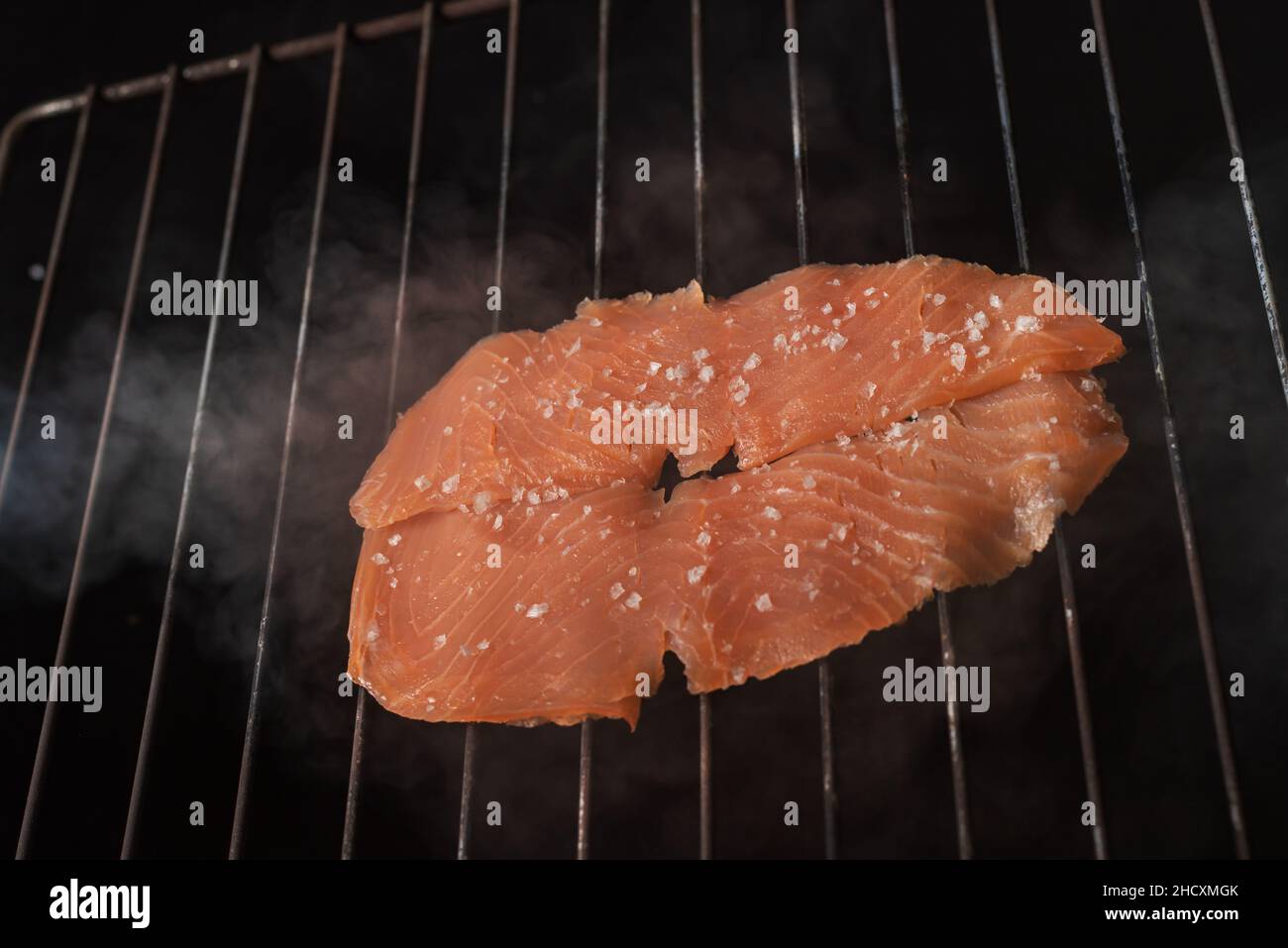 Smoked salmon fillets on a grill Stock Photo - Alamy