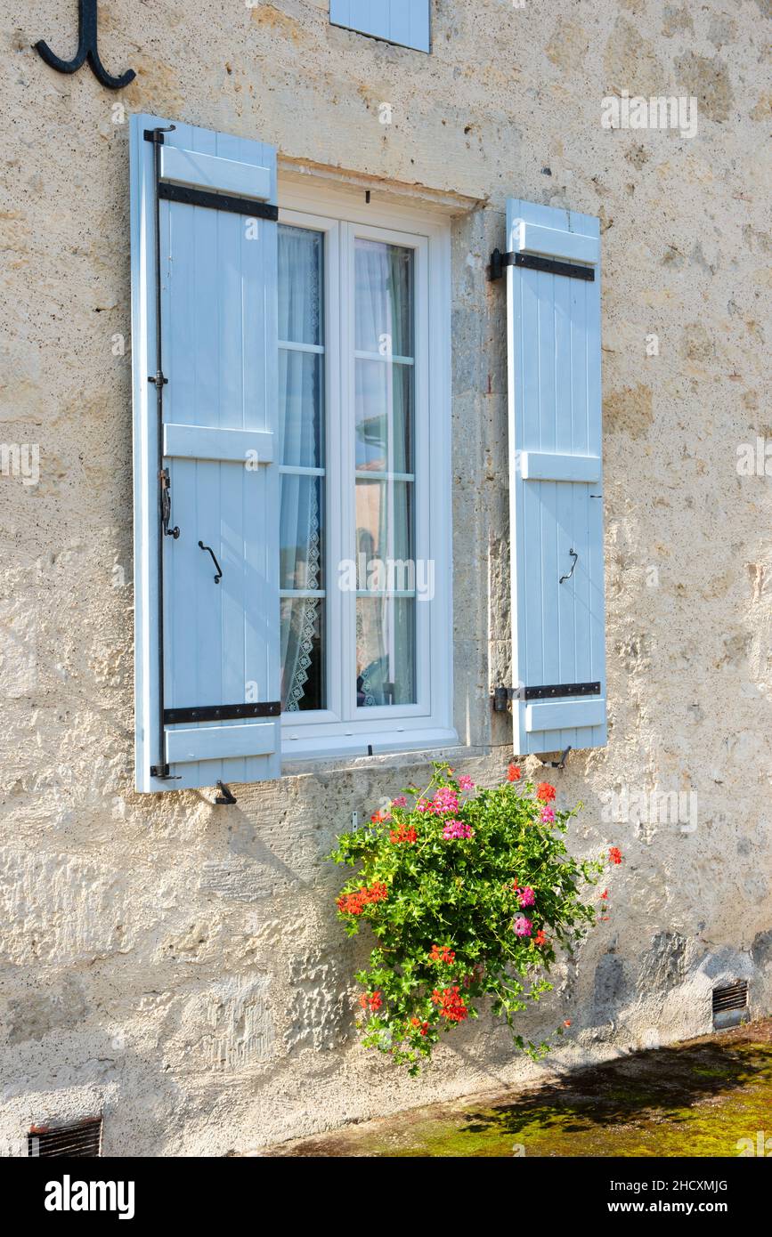 Blue french window with shutters and flowers Stock Photo - Alamy