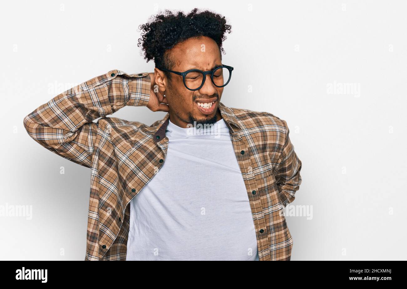 Young african american man with beard wearing casual clothes and ...