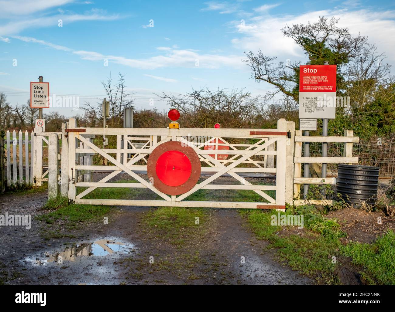 Reedham, Norfolk, UK – January 2022. The railway level crossing gate on ...
