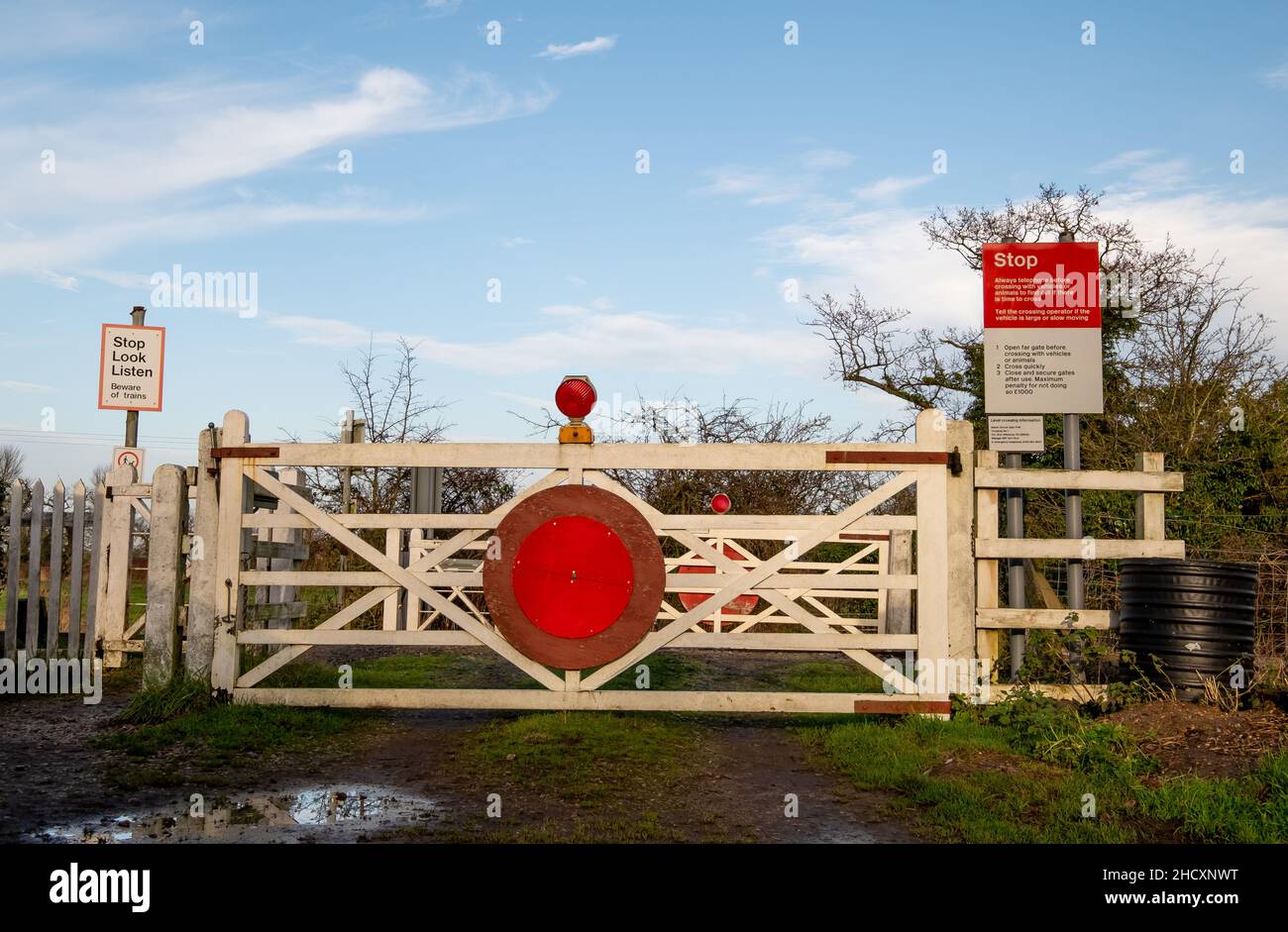 Reedham, Norfolk, UK – January 2022. The railway level crossing gate on ...