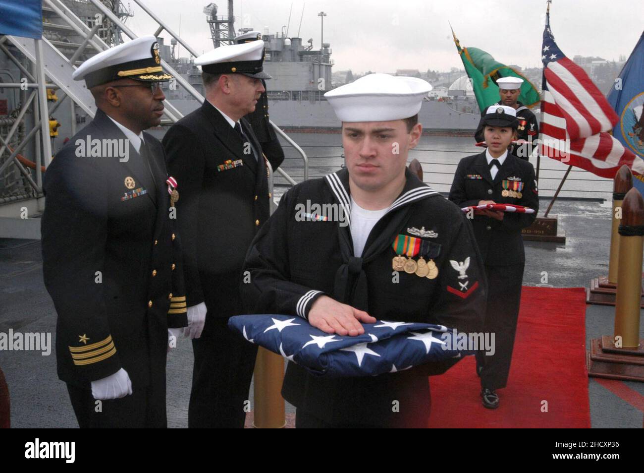 Removal of flags from USS Fife Stock Photo - Alamy