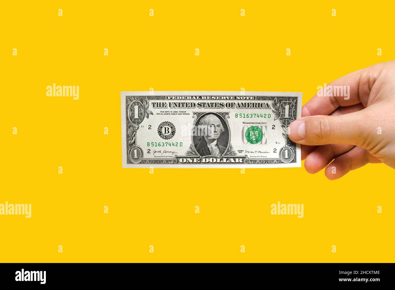 Money in hand, banknote in hand. Hand holding one dollar banknote ...