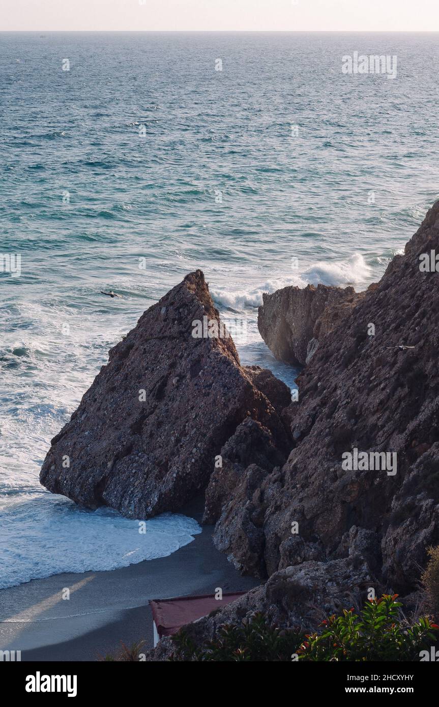 Sunset. Wild rock beach. The natural rock formation Stock Photo - Alamy