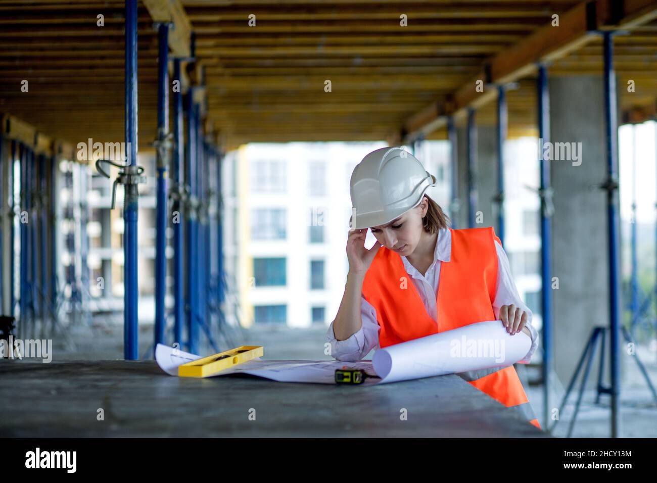 Architect or engineer working, browsing building project indoor of ...