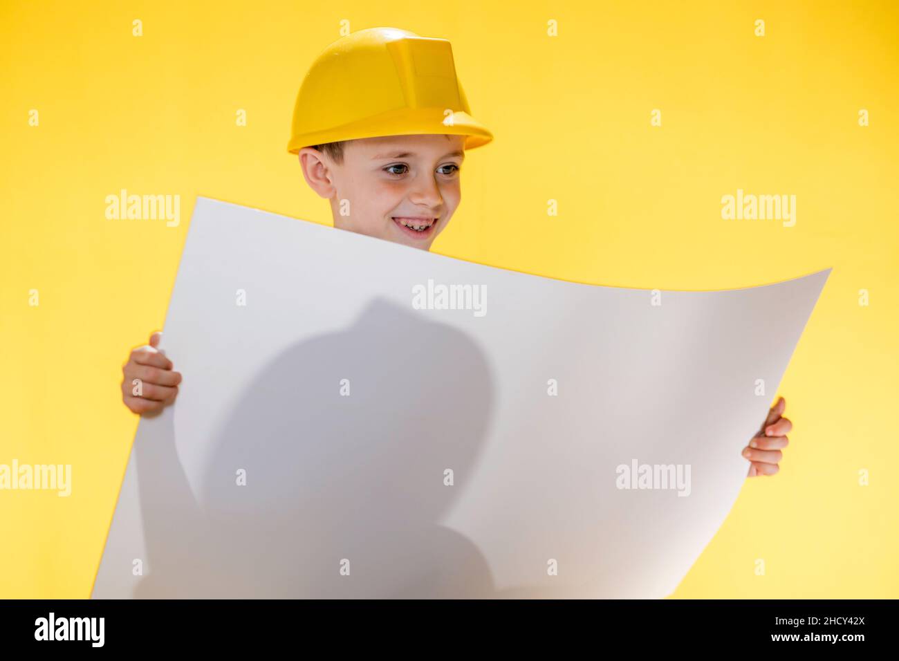A little boy holding plan project in his hands dreams of becoming a ...
