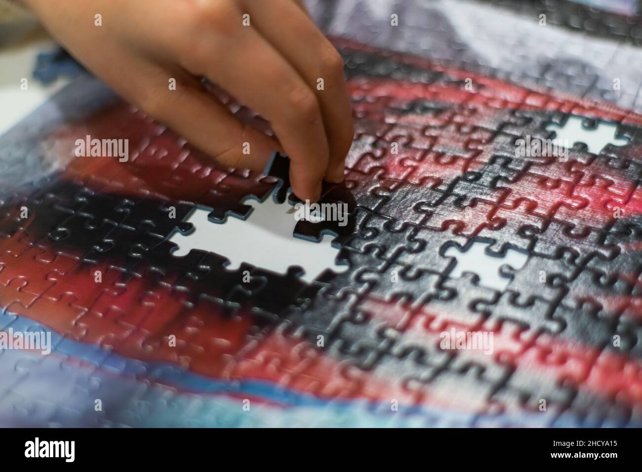 Assembling a puzzle, hands on puzzles, puzzle missing pieces ...