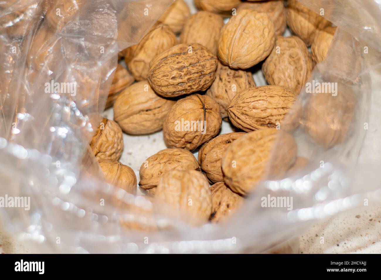 Nuts on a plastic bag Stock Photo - Alamy