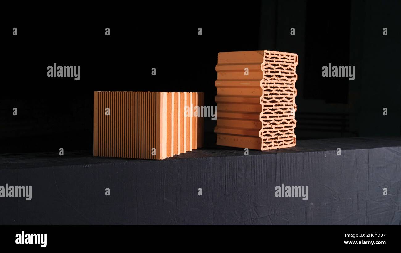 Close-up of two red bricks on black background. Stock footage ...