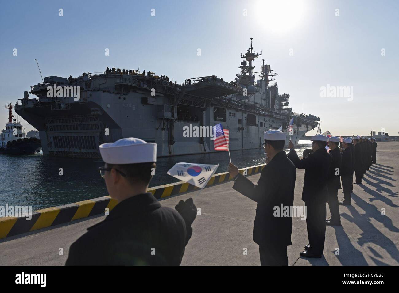 Republic of Korea Sailors wave U.S. and ROK flags as USS Bonhomme ...