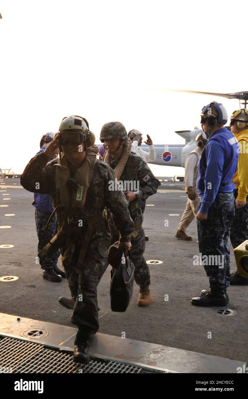Republic of Korea Navy Rear Adm. Chun Jung-soo, front, salutes as he ...