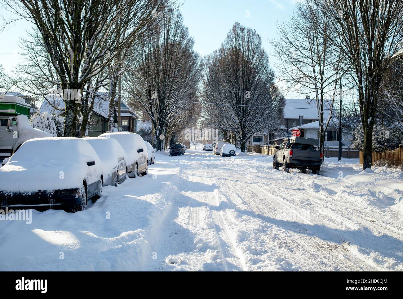 Snow covered residential street after heavy snow fall over night. Early ...