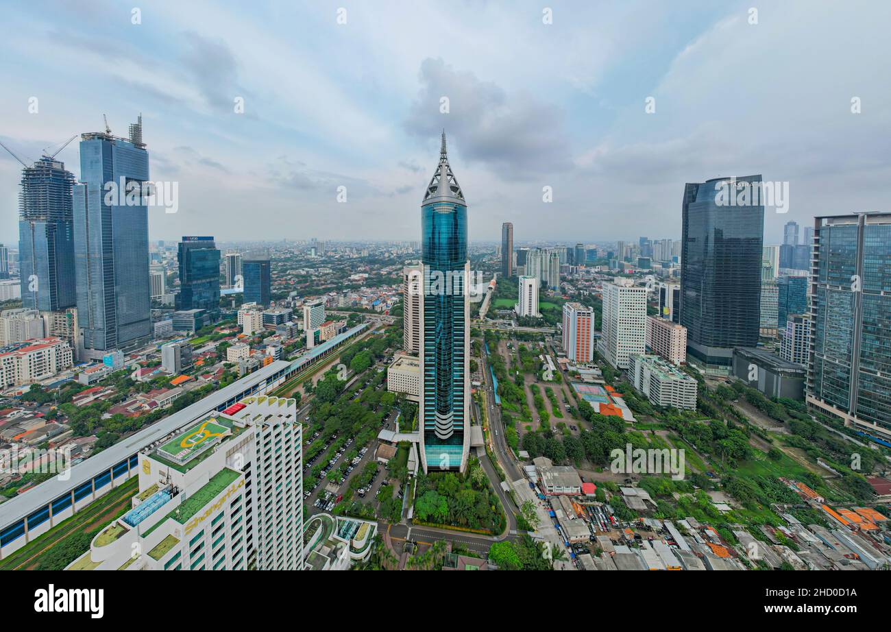 Aerial view of BNI 46 building in Jakarta and noise cloud with ...