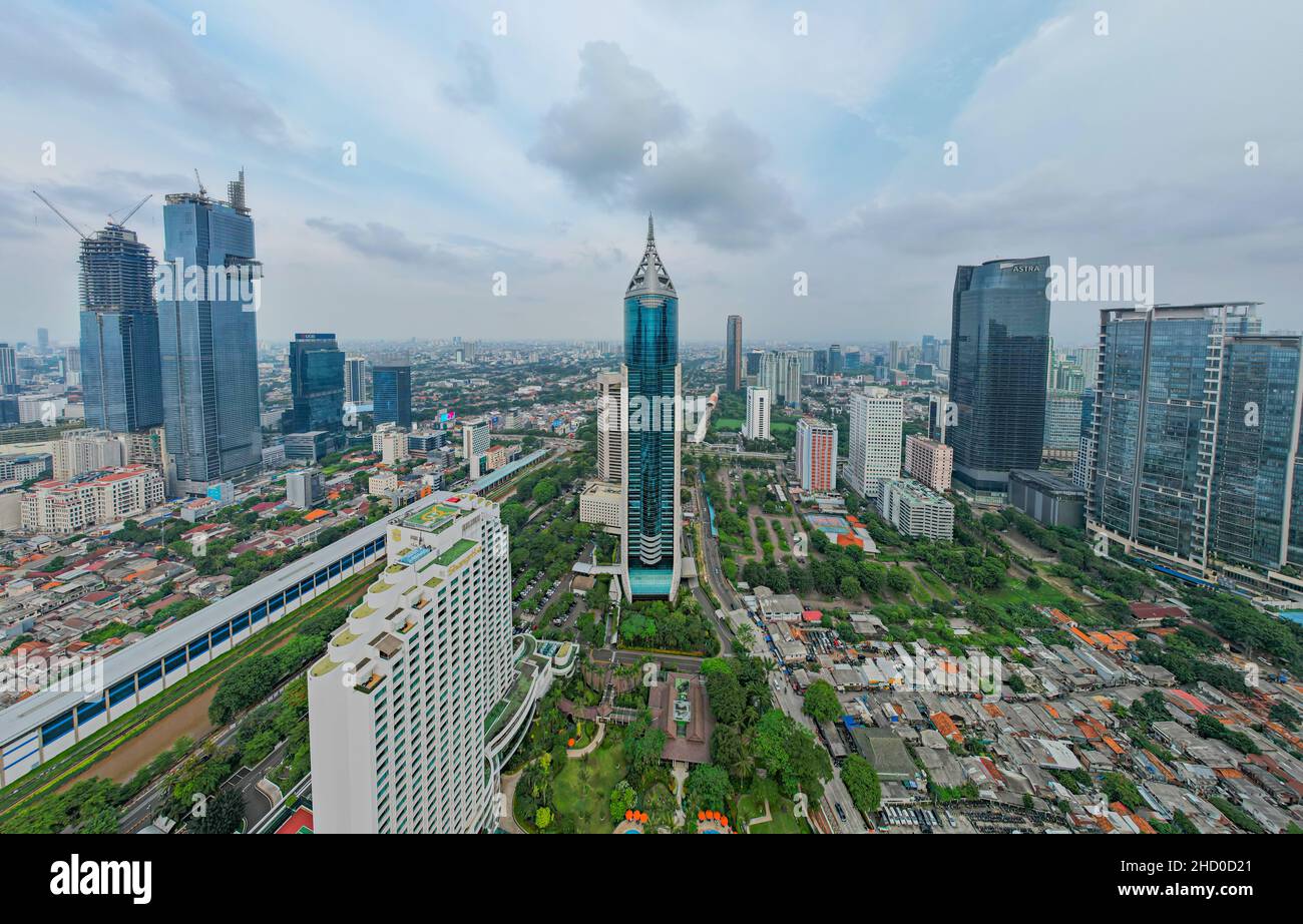 Aerial view of BNI 46 building in Jakarta and noise cloud with ...